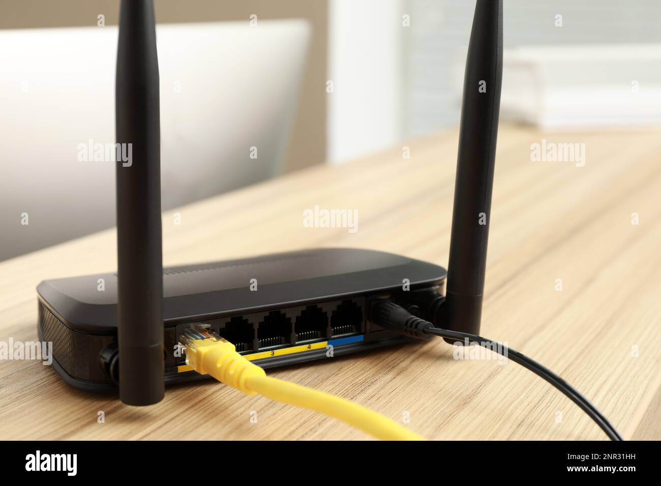 Modern wi-fi router on wooden counter indoors, closeup Stock Photo - Alamy