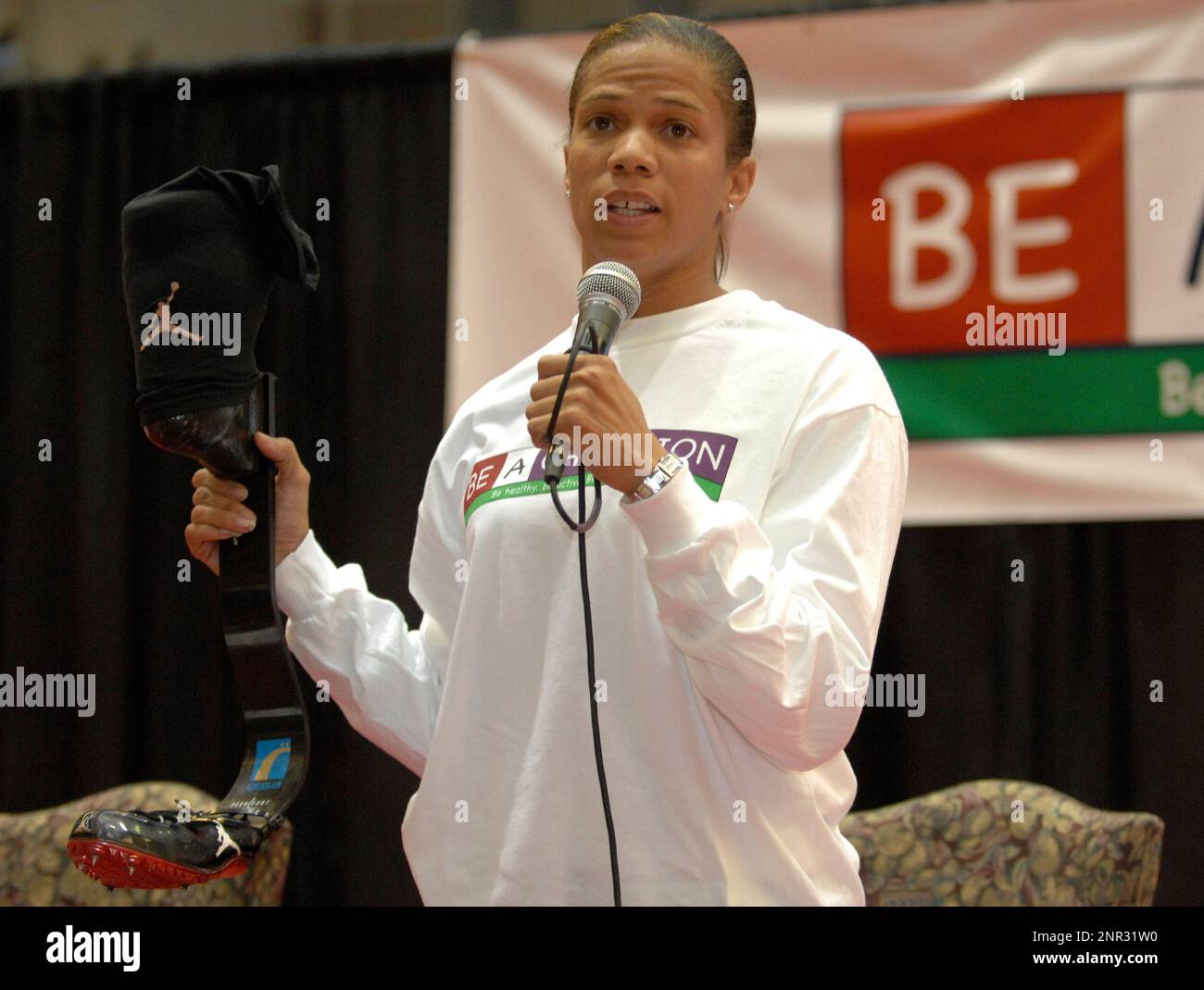 Paralympian April Holmes shows her prosthetic leg at the Penn Relays ...