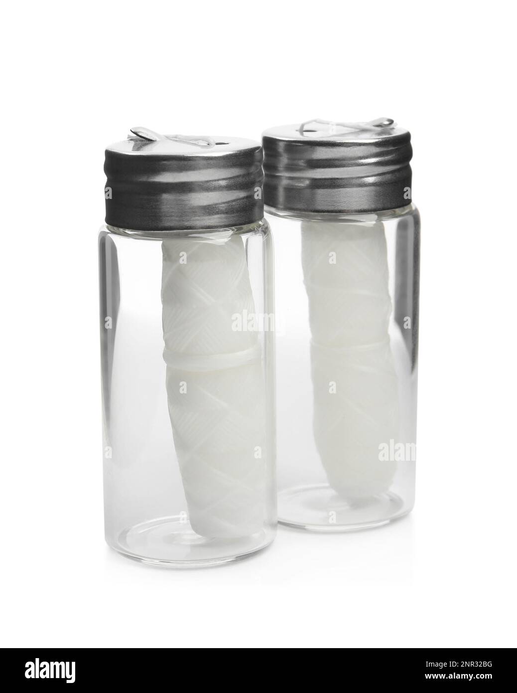 Rolls of natural organic dental floss in jars on white background Stock ...