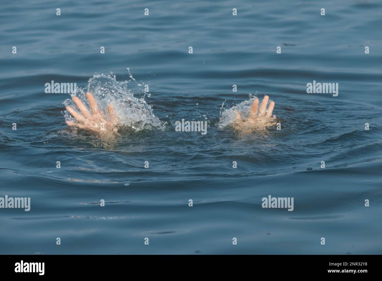 Drowning woman reaching for help in sea, closeup Stock Photo - Alamy