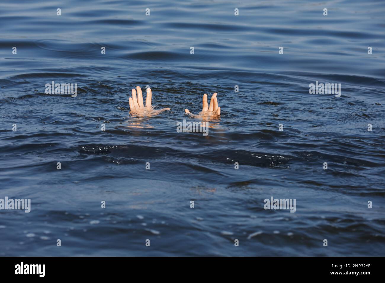 Drowning woman reaching for help in sea, closeup Stock Photo - Alamy