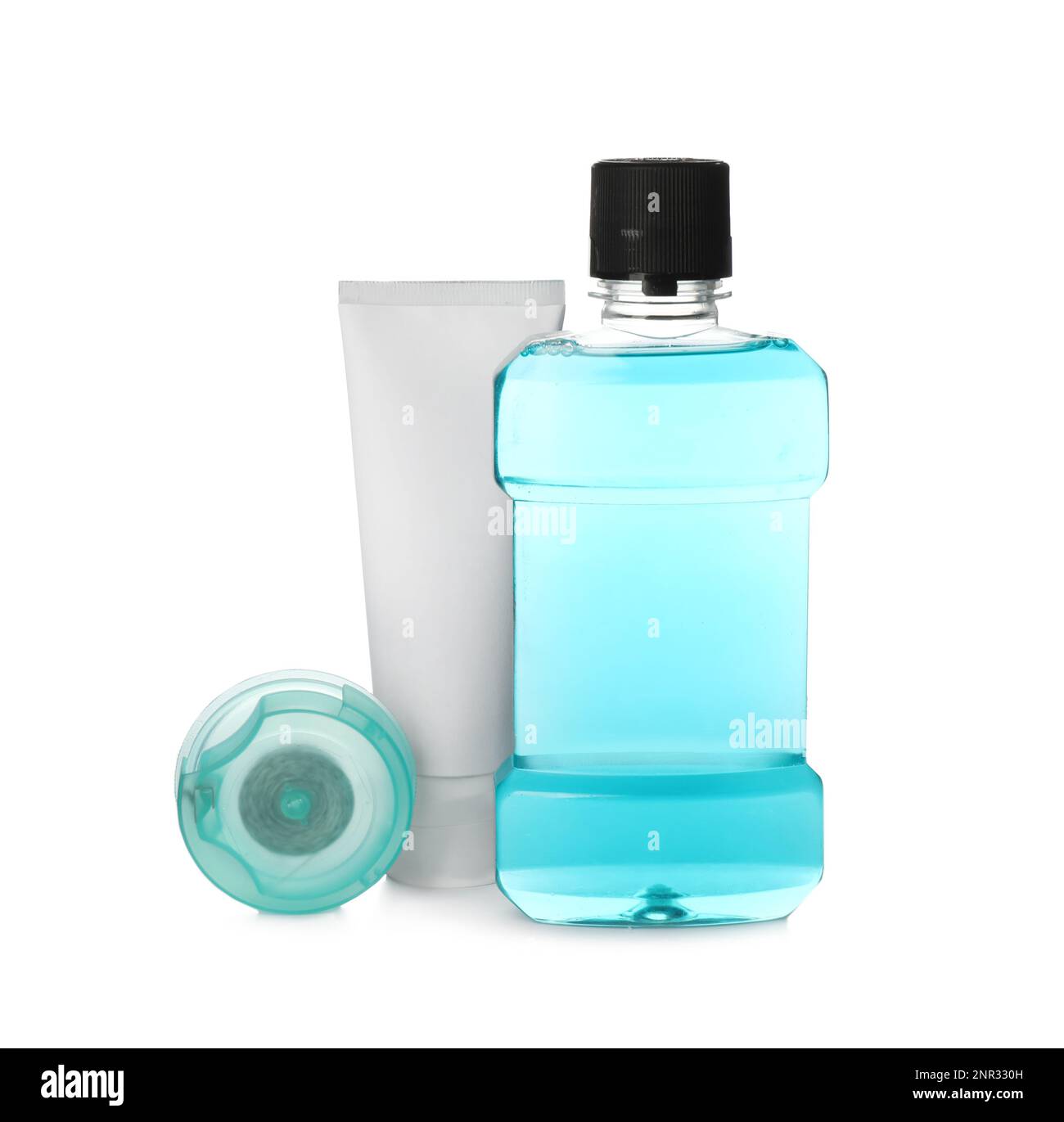 Mouthwash, dental floss and toothpaste on white background Stock Photo ...