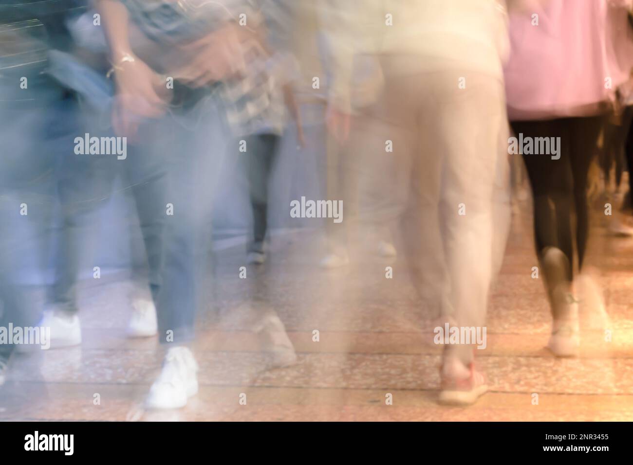 People walking under an hystorical porch in Italy (Bologna), with ...