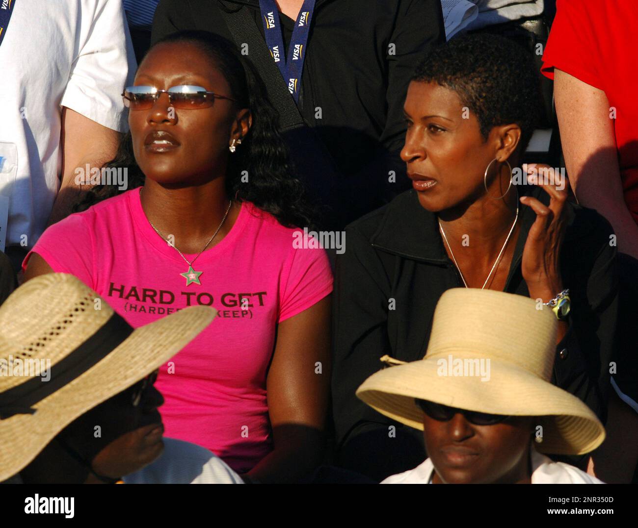Chryste Gaines (left) and Tisha Waller watch from the bleachers during ...
