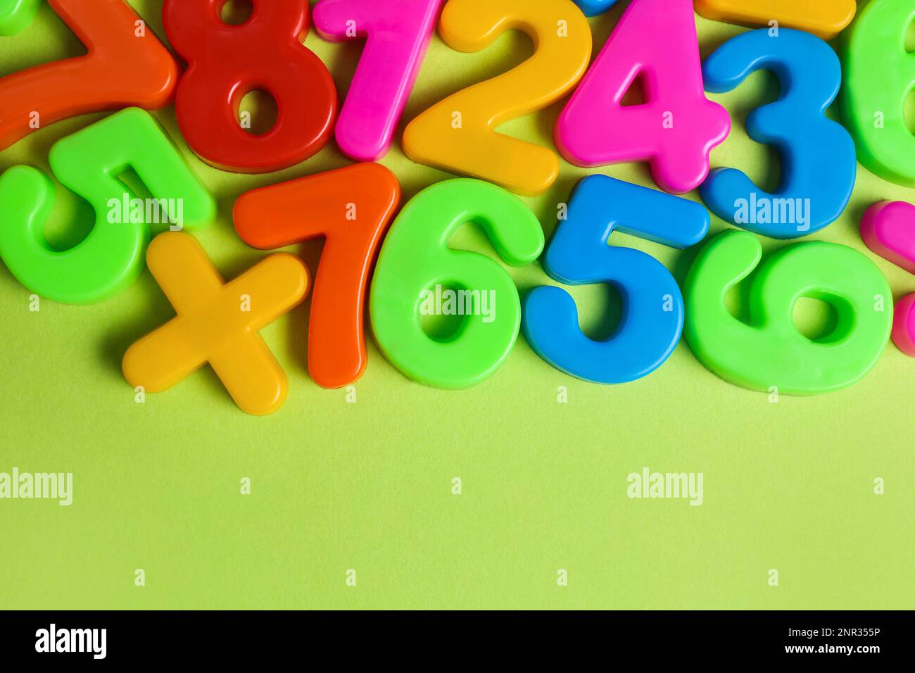 Colorful magnetic numbers on light green background, flat lay Stock ...