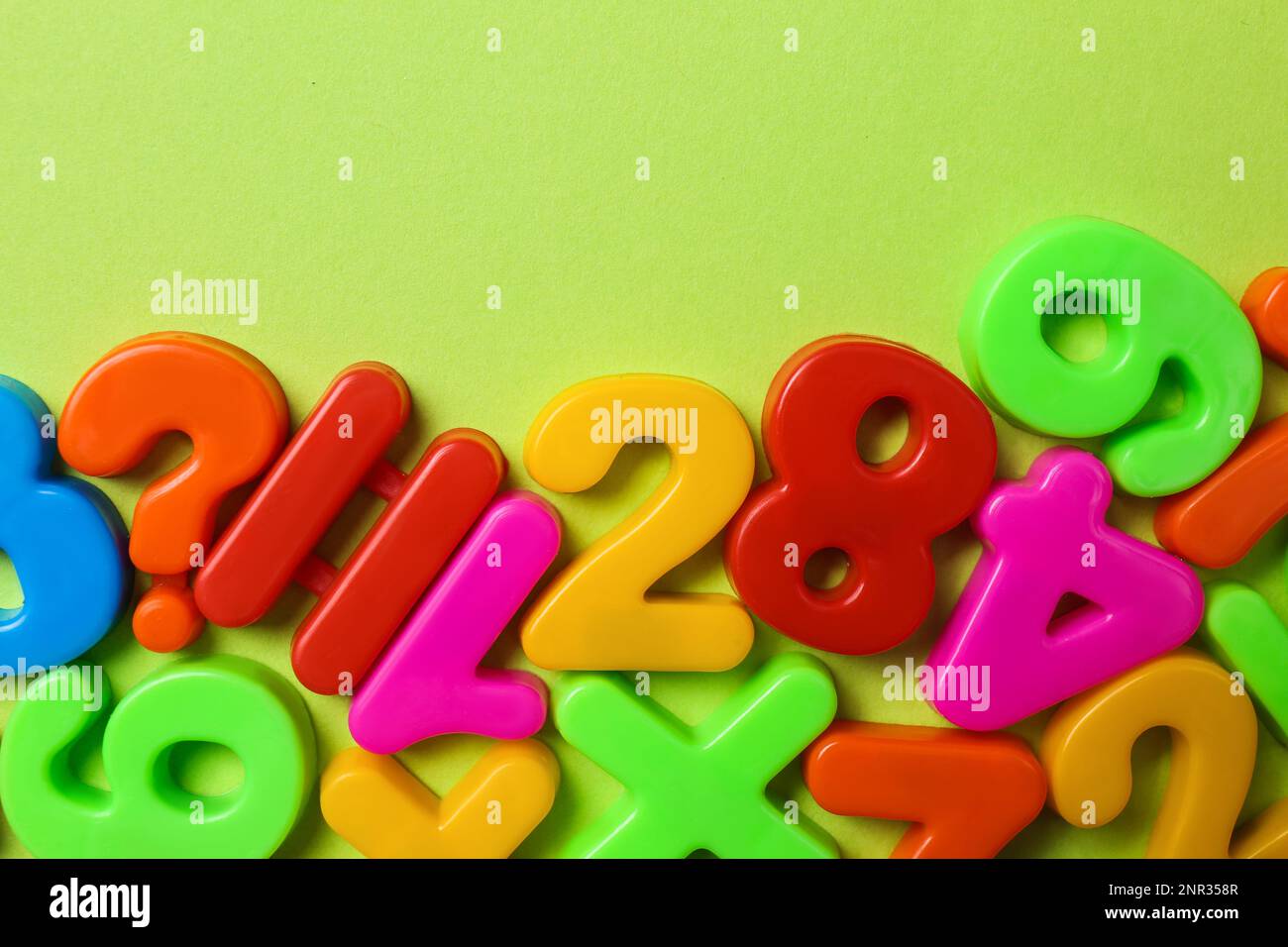 Colorful magnetic numbers on light green background, flat lay Stock ...