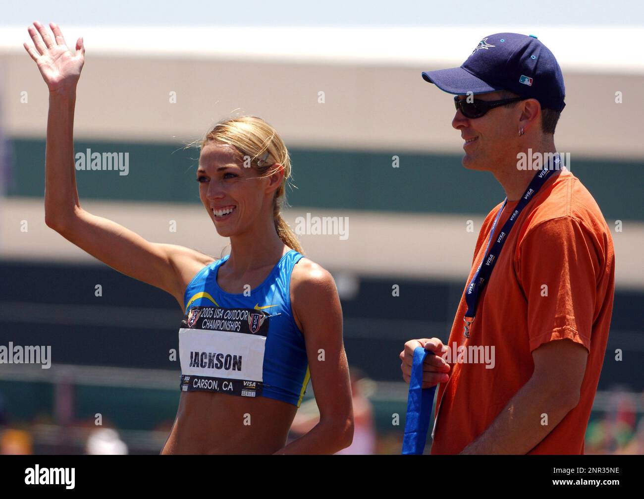Women's steeplechase winner Elizabeth Jackson is presented first-place ...