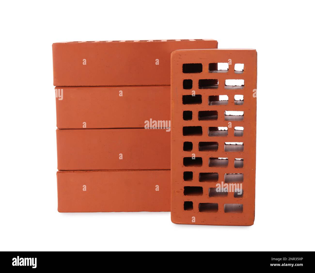 Many red bricks on white background. Building material Stock Photo - Alamy