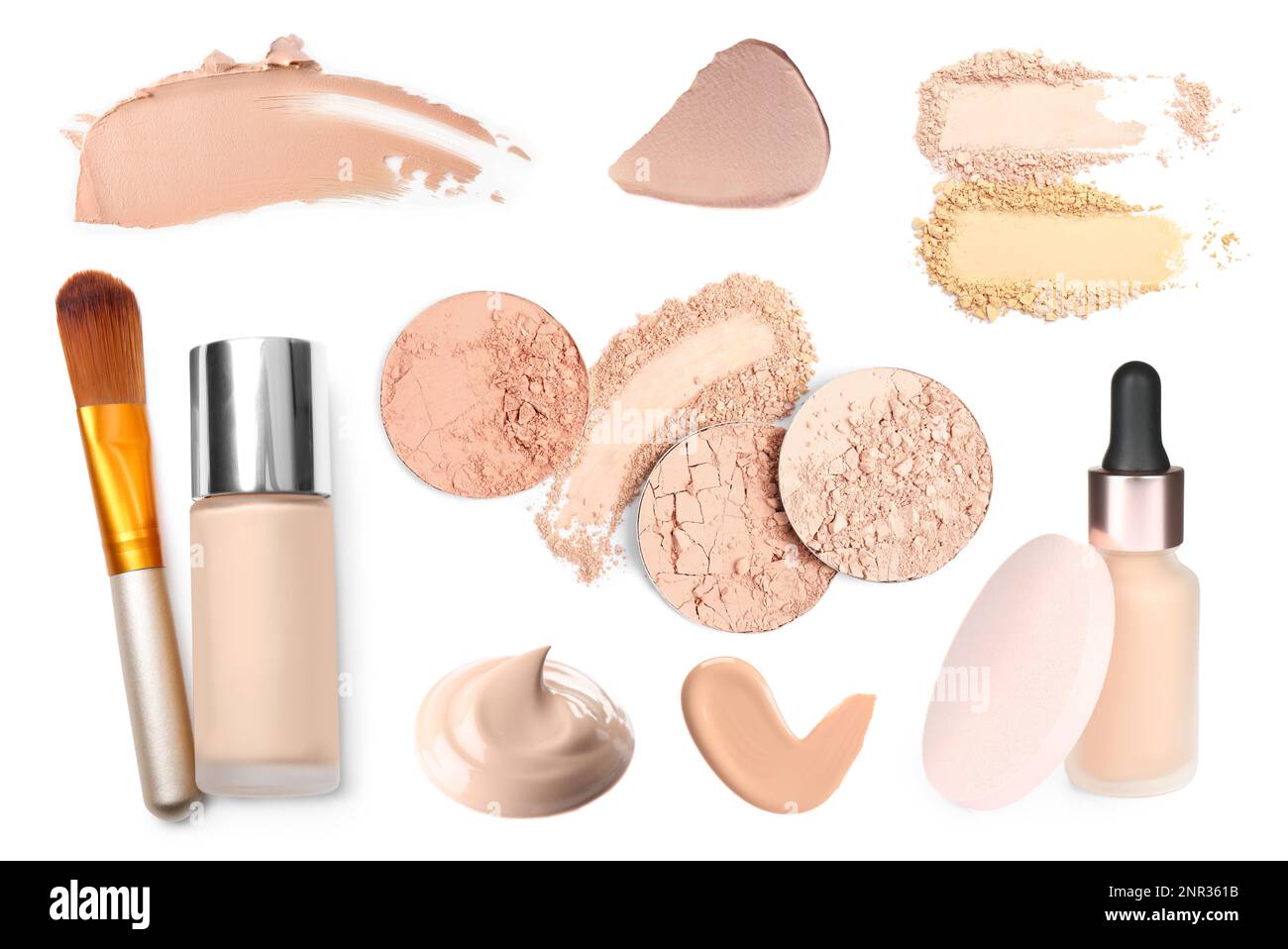 Set with different liquid foundation and face powder on white ...