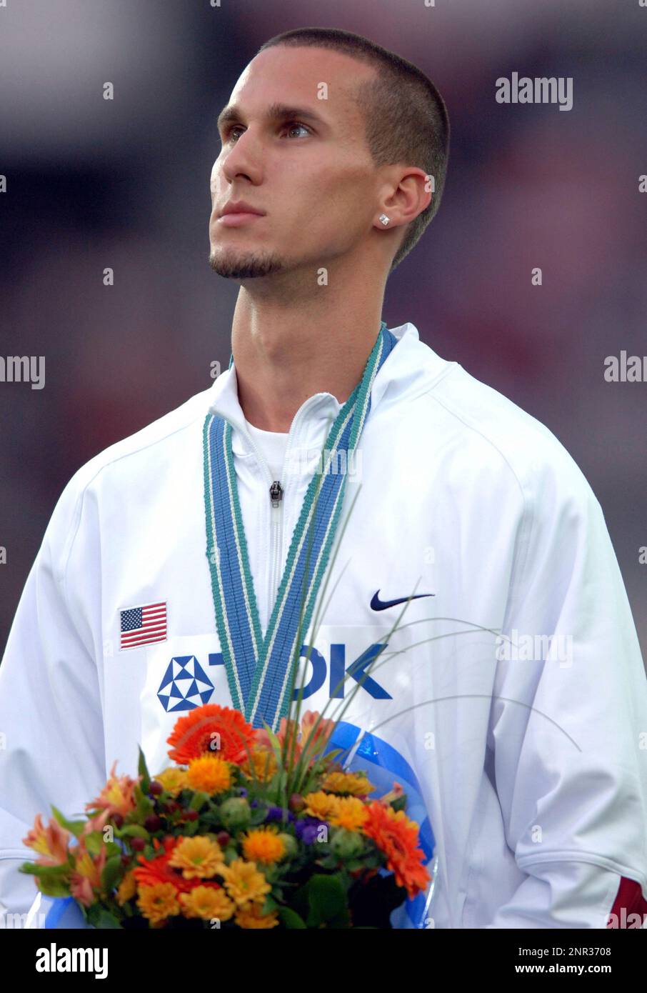 Gold medalist Jeremy Wariner of the United States listens to national ...