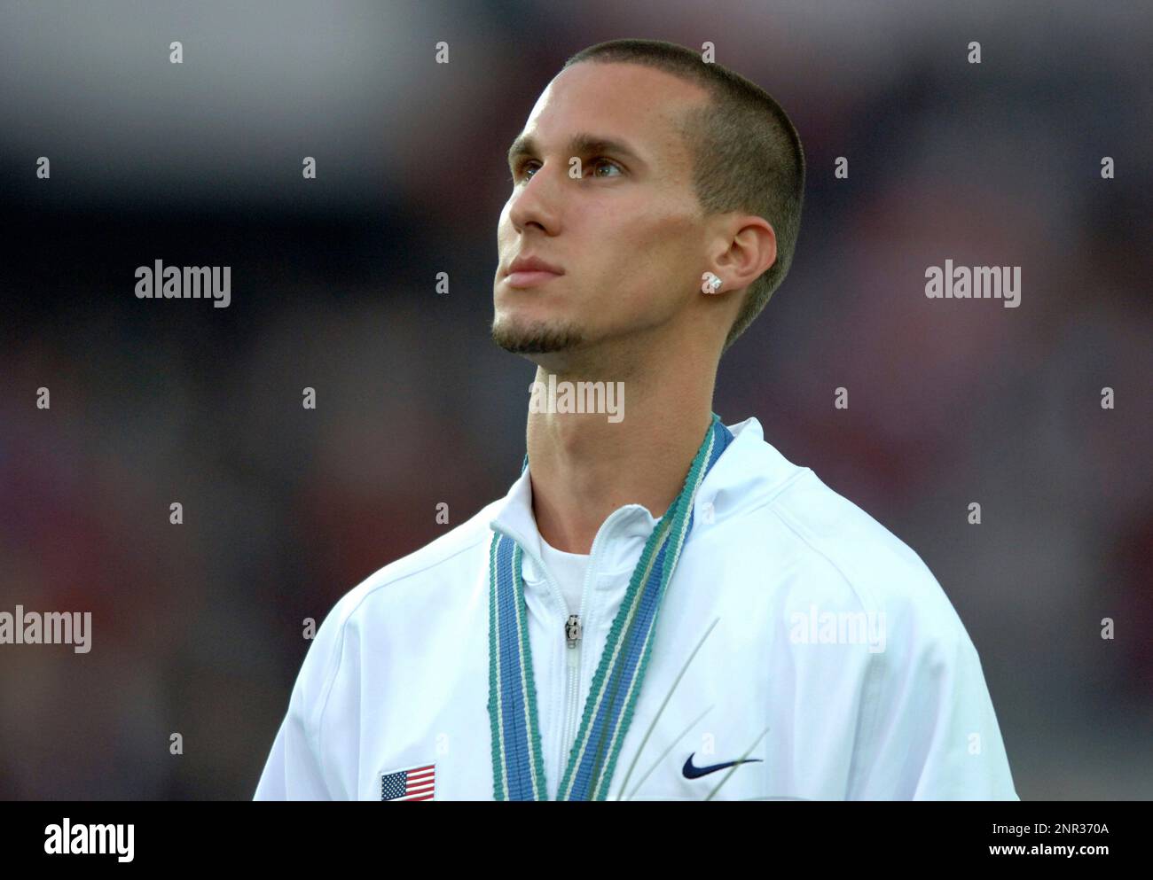 Gold medalist Jeremy Wariner of the United States listens to national ...