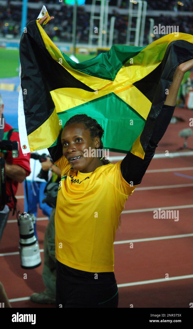 Trecia Smith of Jamaica takes victory lap with flag after winning the ...