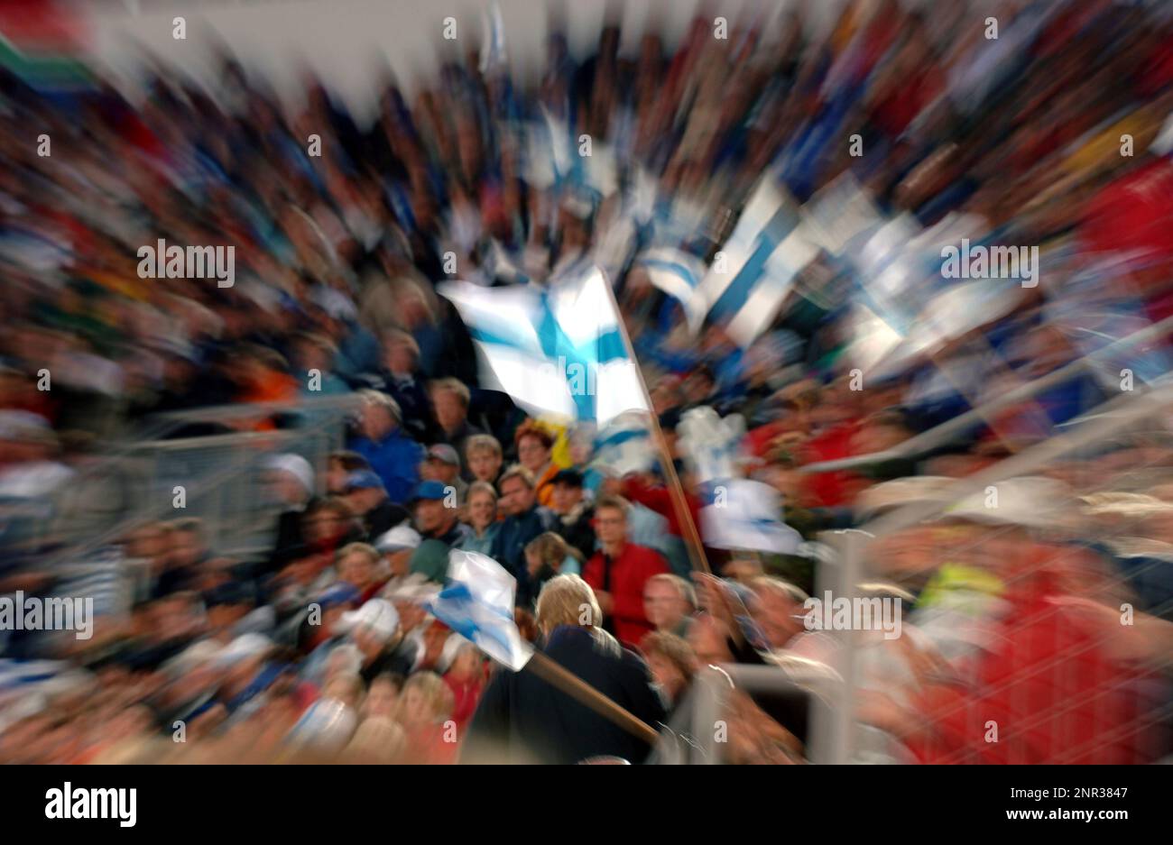 Spectators wave Finland flags during the men's long jump final in the ...