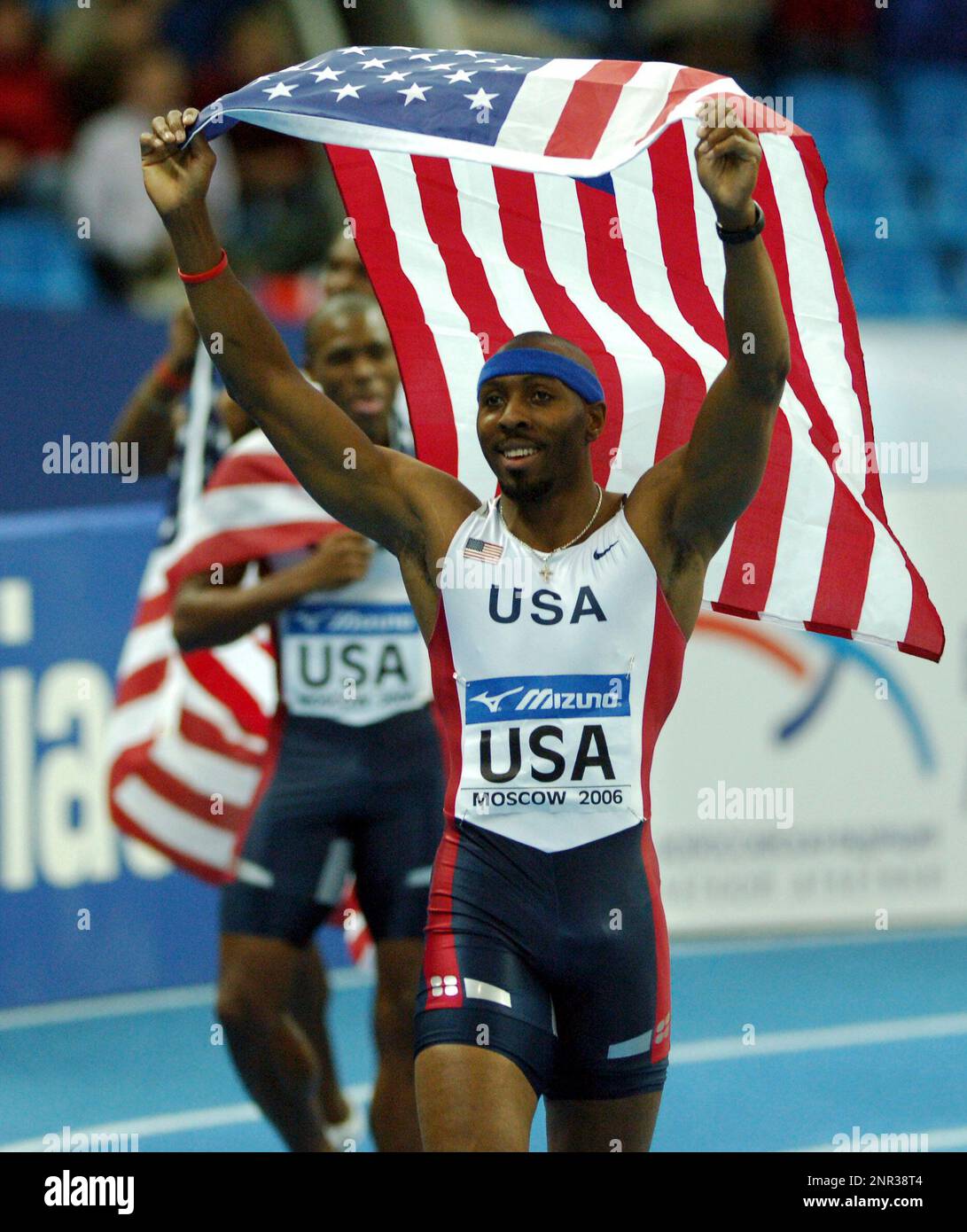 Tyree Washington poses with an American flag after running the leadoff ...