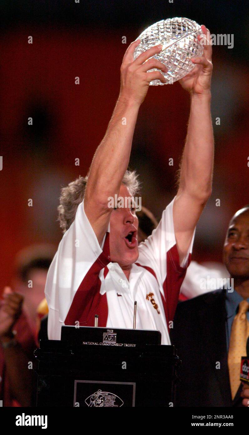 USC coach Pete Carroll holds BCS Championship trophy after 55-19 ...
