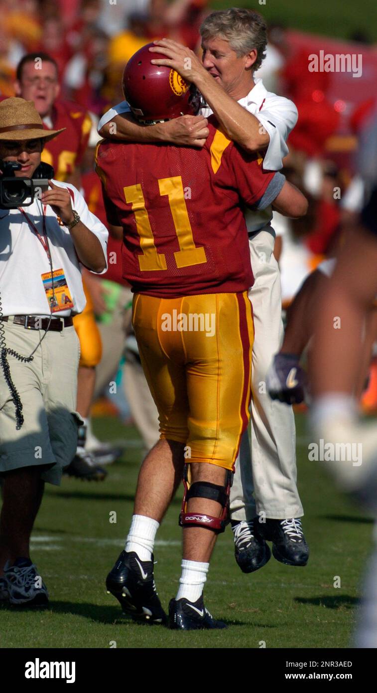 USC quarterback Matt Leinart and coach Pete Carroll celebrate 23-17 ...