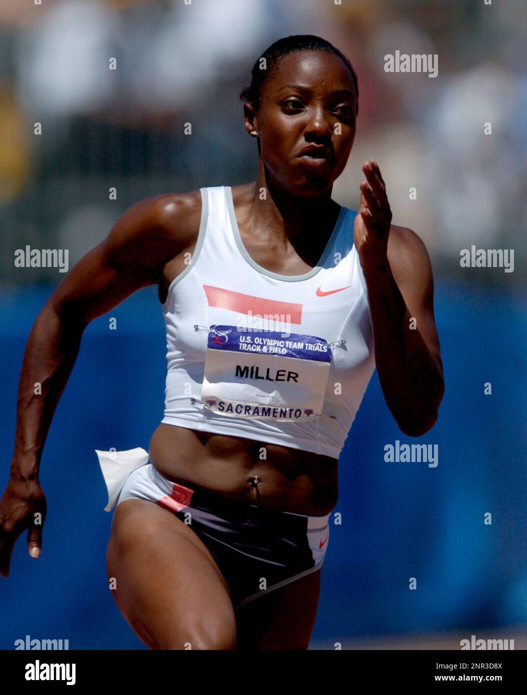 Inger Miller runs in a women's 200m hein the U.S. Olympic Track & Field ...
