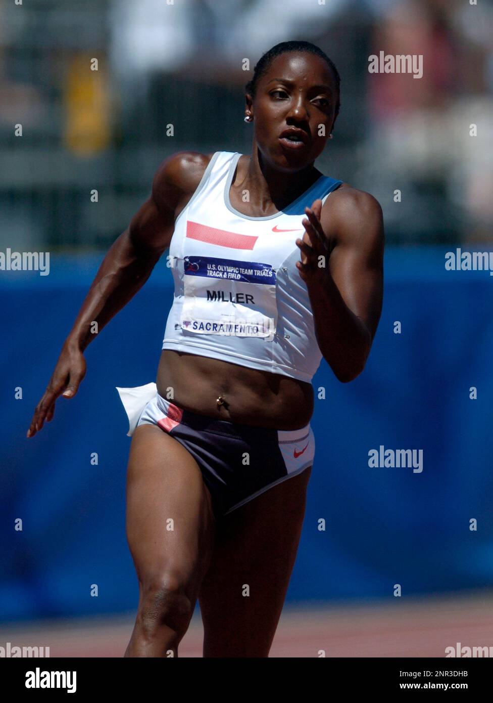 Inger Miller runs in a women's 200m hein the U.S. Olympic Track & Field ...