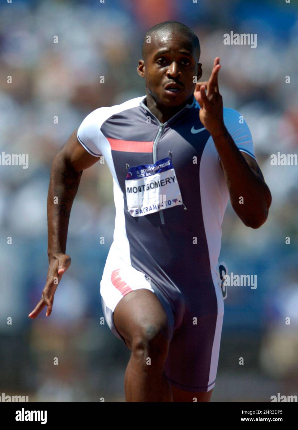 Tim Montgomery places third in men's 100-meter first-round hein 10.21 ...