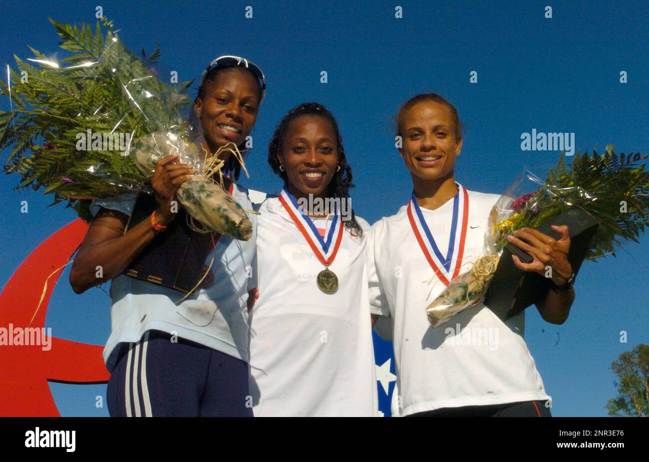 Women's 100-meter hurdle medallists from left: Melissa Morrison (third ...