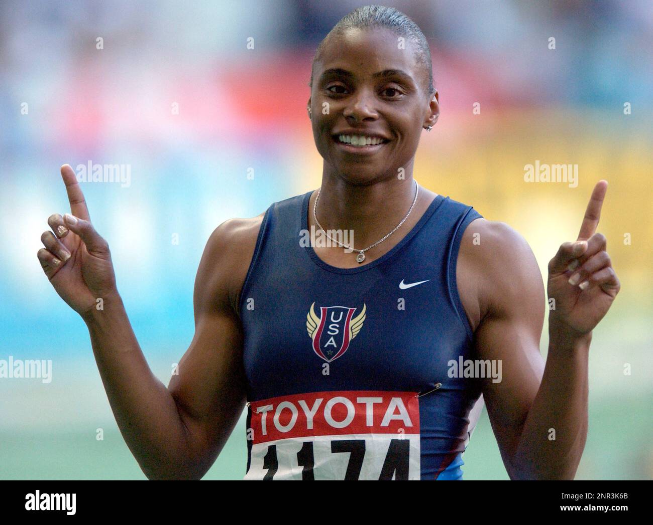 Kelli White of the United States celebrates after winning the 100 ...