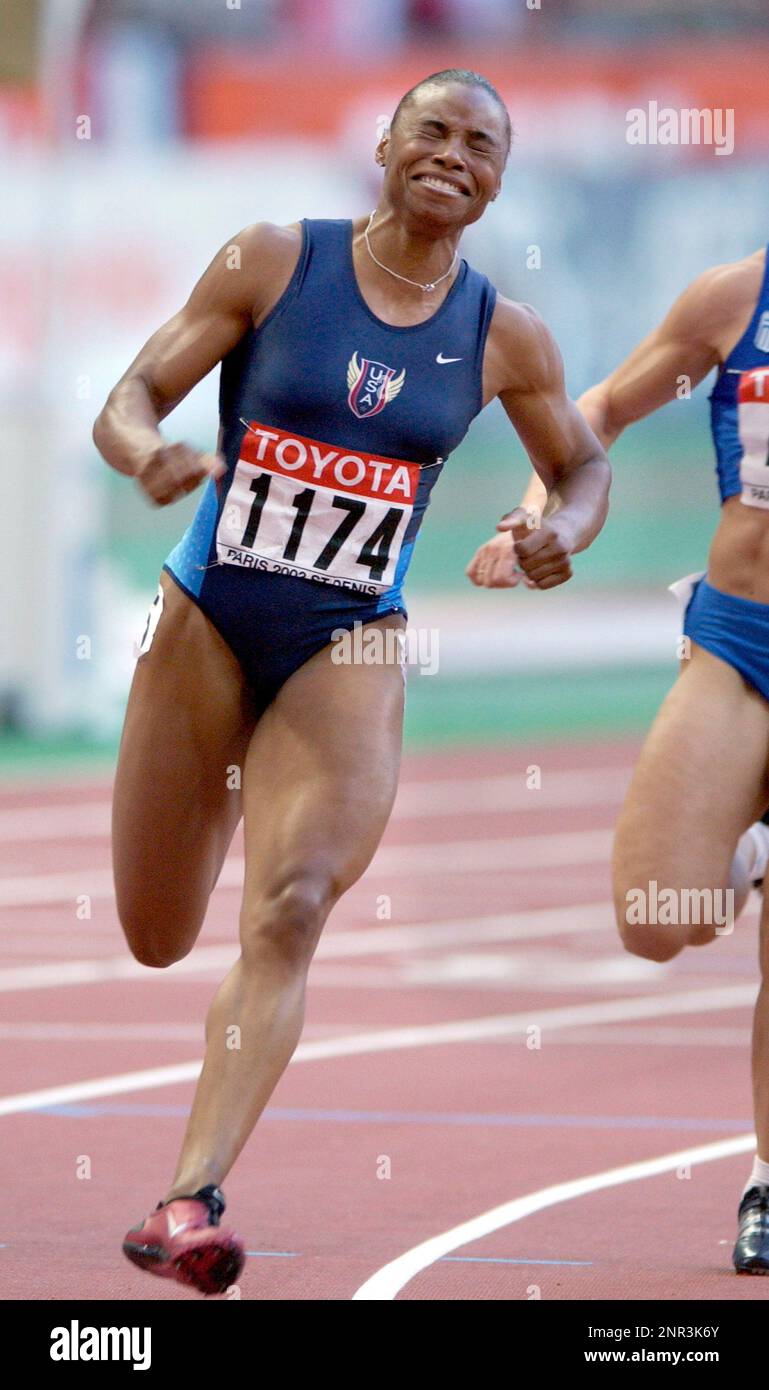Kelli White of the United States celebrates after winning the 100 ...