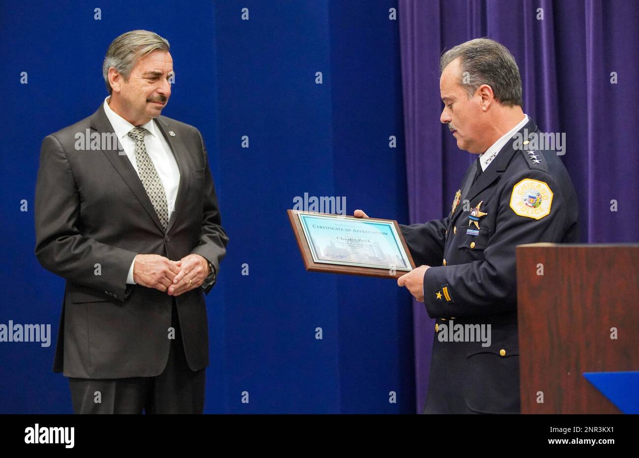 Charlie Beck, left, interim superintendent of the Chicago Police Department, listens as First ...