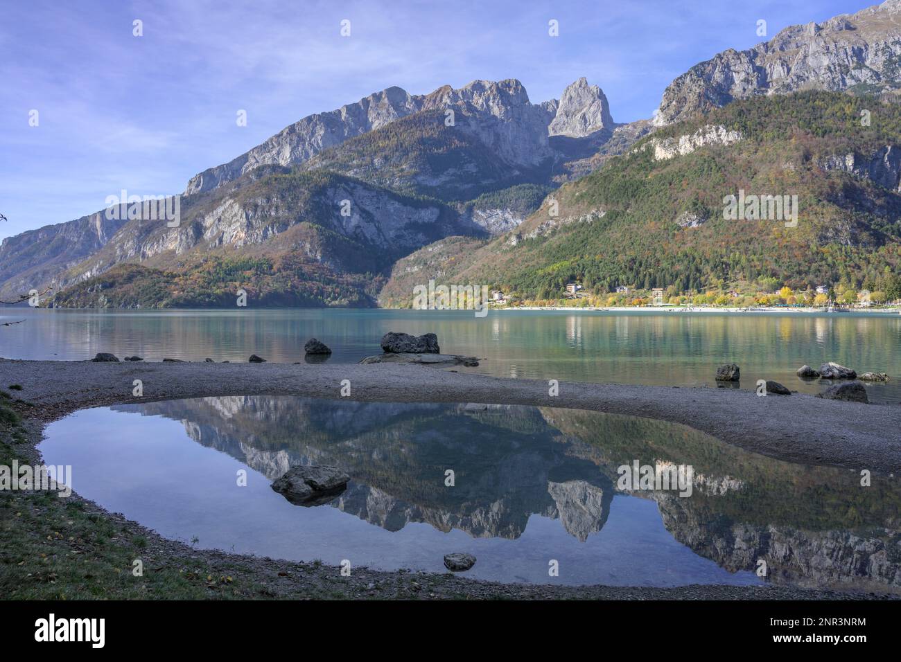 Mountains of the Brenta Group reflected in a small lagoon of Lake ...