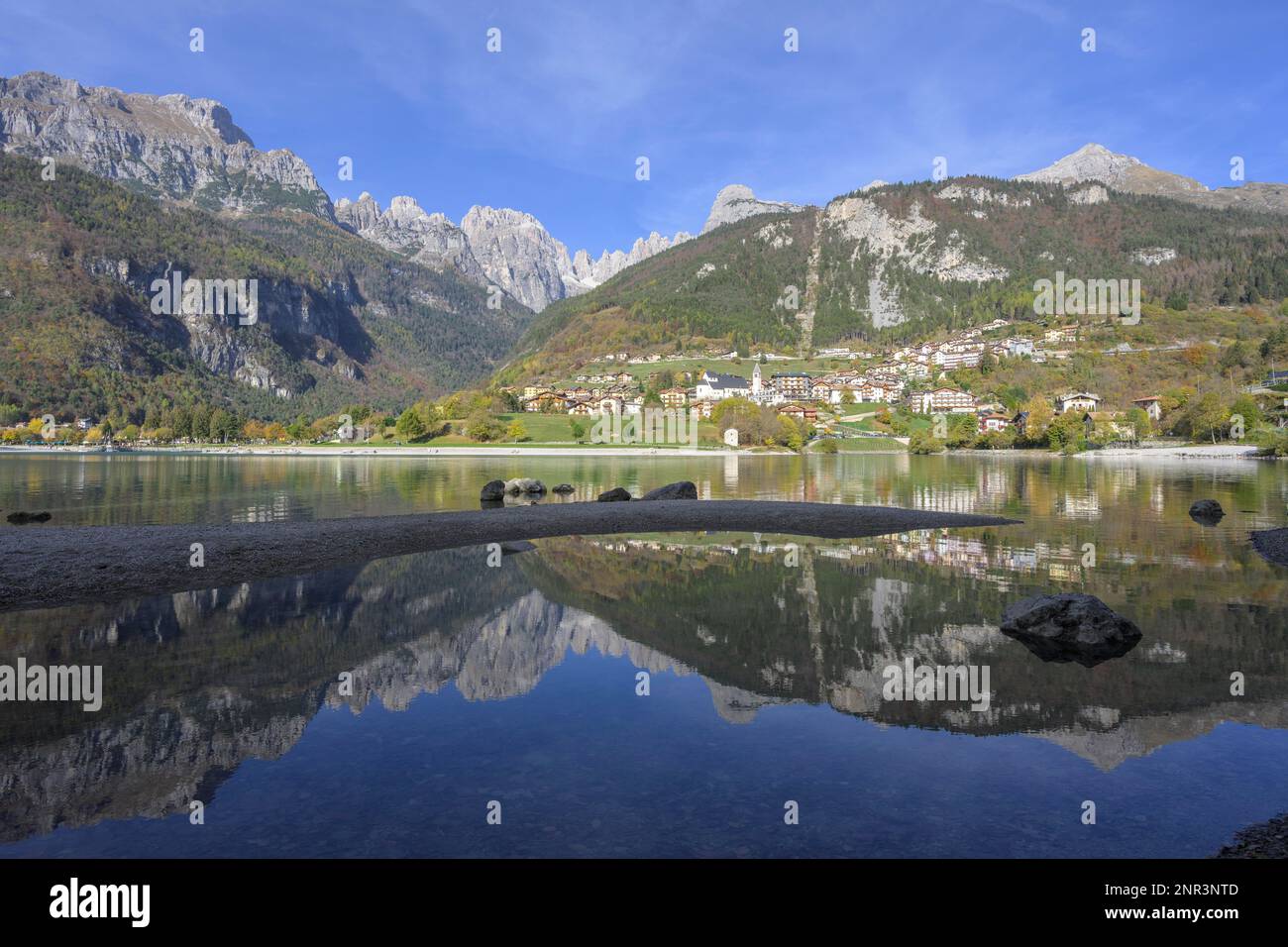 Mountains of the Brenta Group reflected in a small lagoon of Lake ...