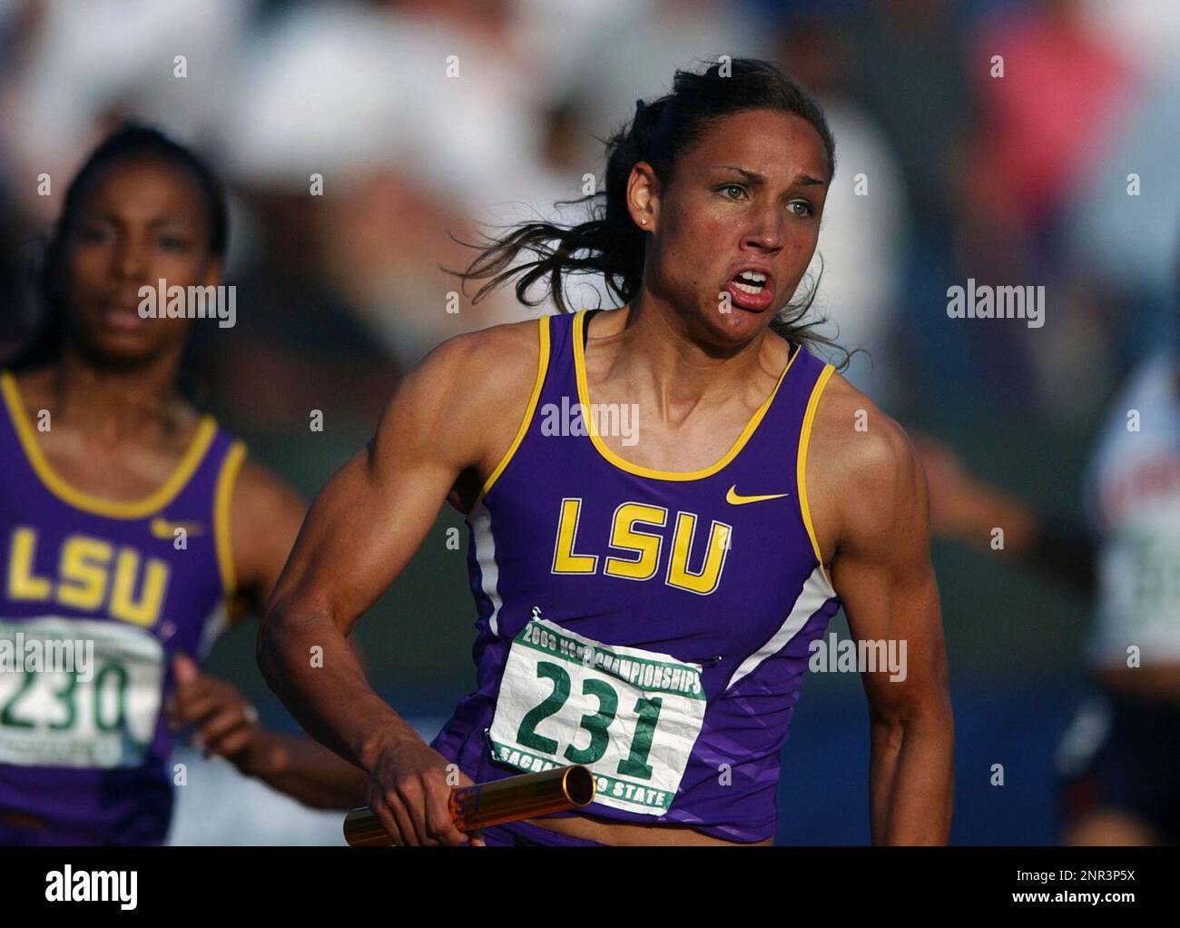 Lolo Jones of LSU takes handoff from Monique Hall on the third leg of ...