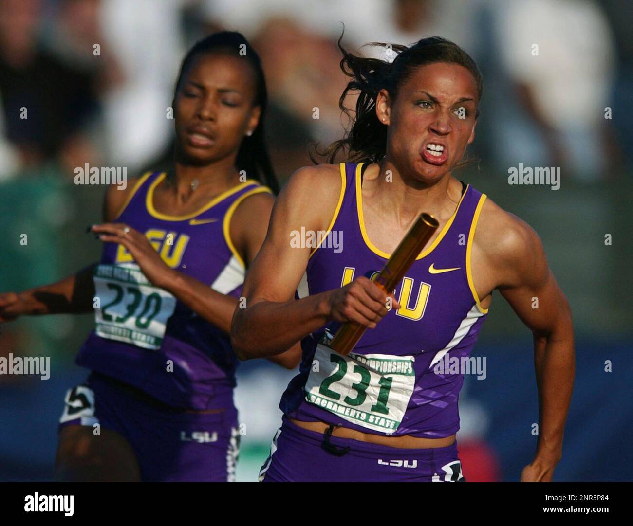 Lolo Jones of LSU takes handoff from Monique Hall on the third leg of ...