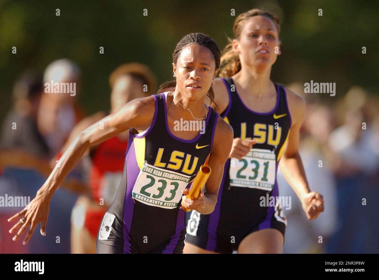 Muna Lee of Louisiana State University takes handoff from Lolo Jones in ...