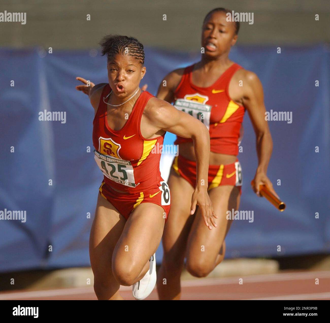 Tracee Thomas takes handoff from Malika Edmonson on the Southern ...
