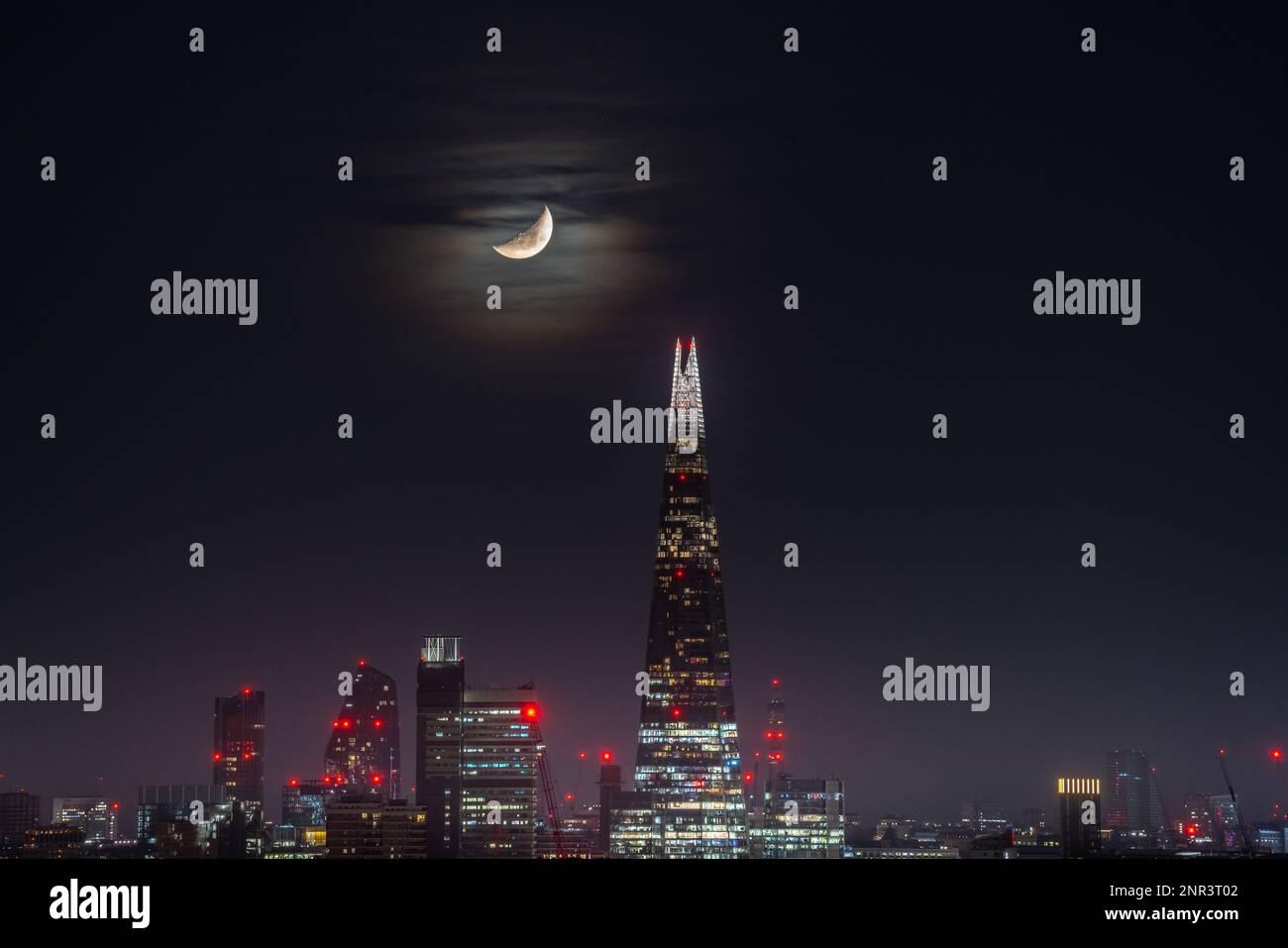 London, UK. 27th February 2023. UK Weather: Moonset over The Shard ...