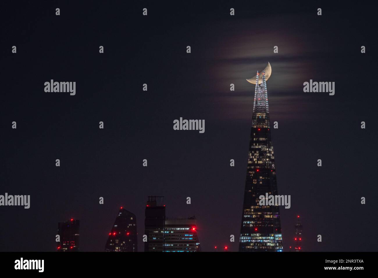 London, UK. 27th February 2023. UK Weather: Moonset over The Shard ...