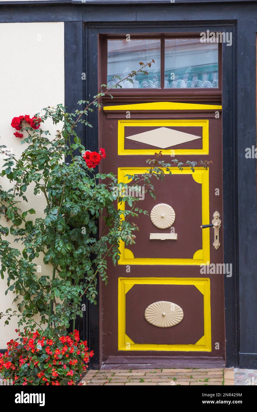 Half-timbered house facade with brown and yellow trim painted wooden ...