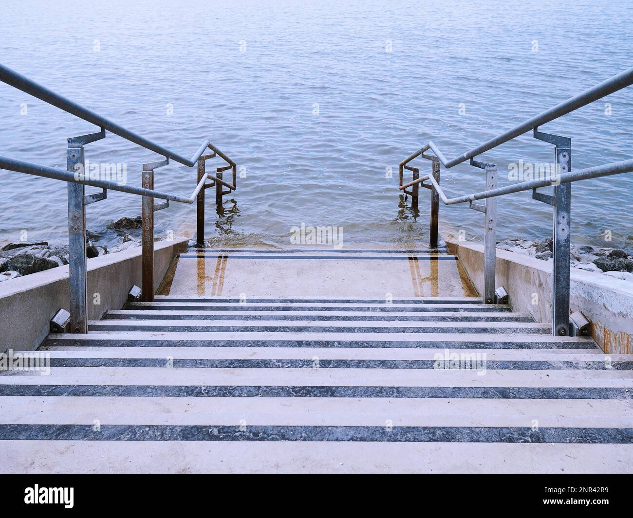 concrete stairs or steps leading down into ocean water Stock Photo - Alamy