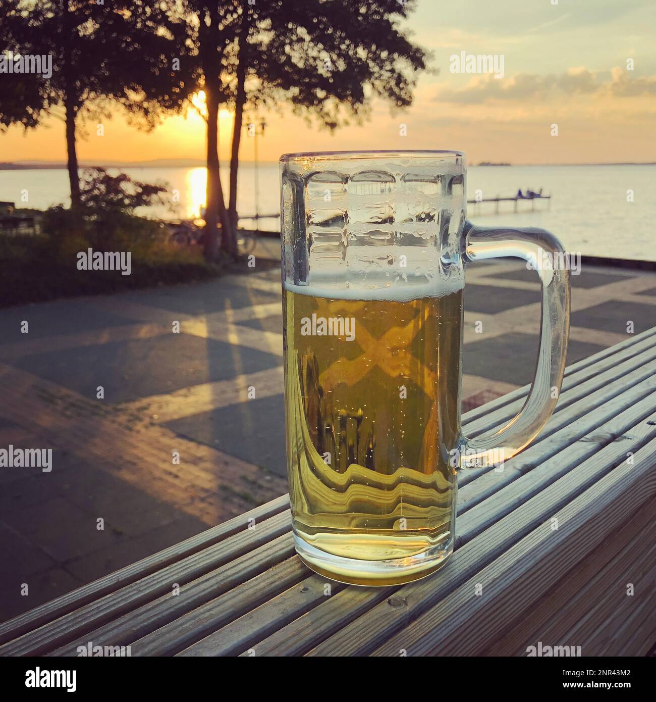 beer glass with sunset at lake Steinhuder Meer in Germany Stock Photo ...