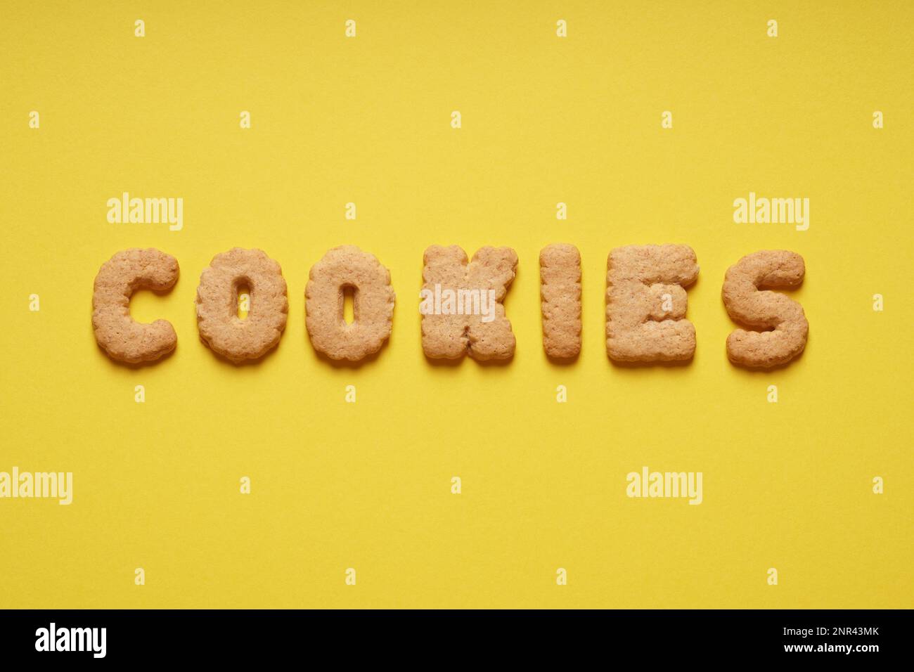 cookies word spelled out with cookie letters or characters on yellow ...