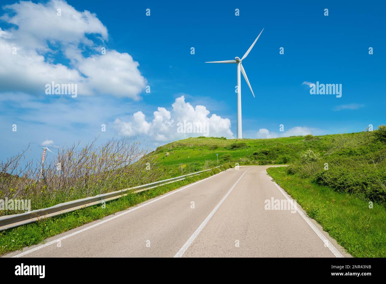 wind turbine at the end of a street Stock Photo - Alamy