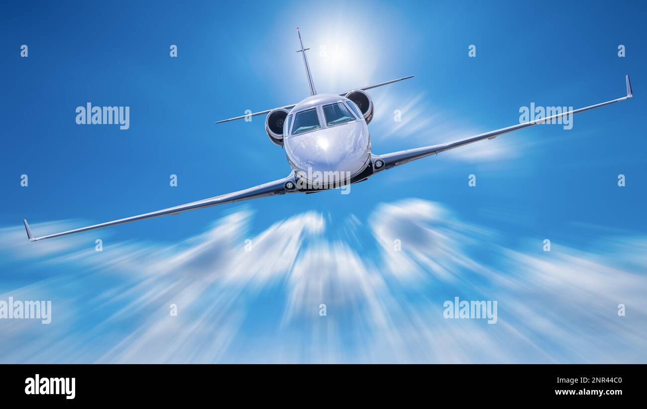 private jet with high speed between clouds Stock Photo - Alamy