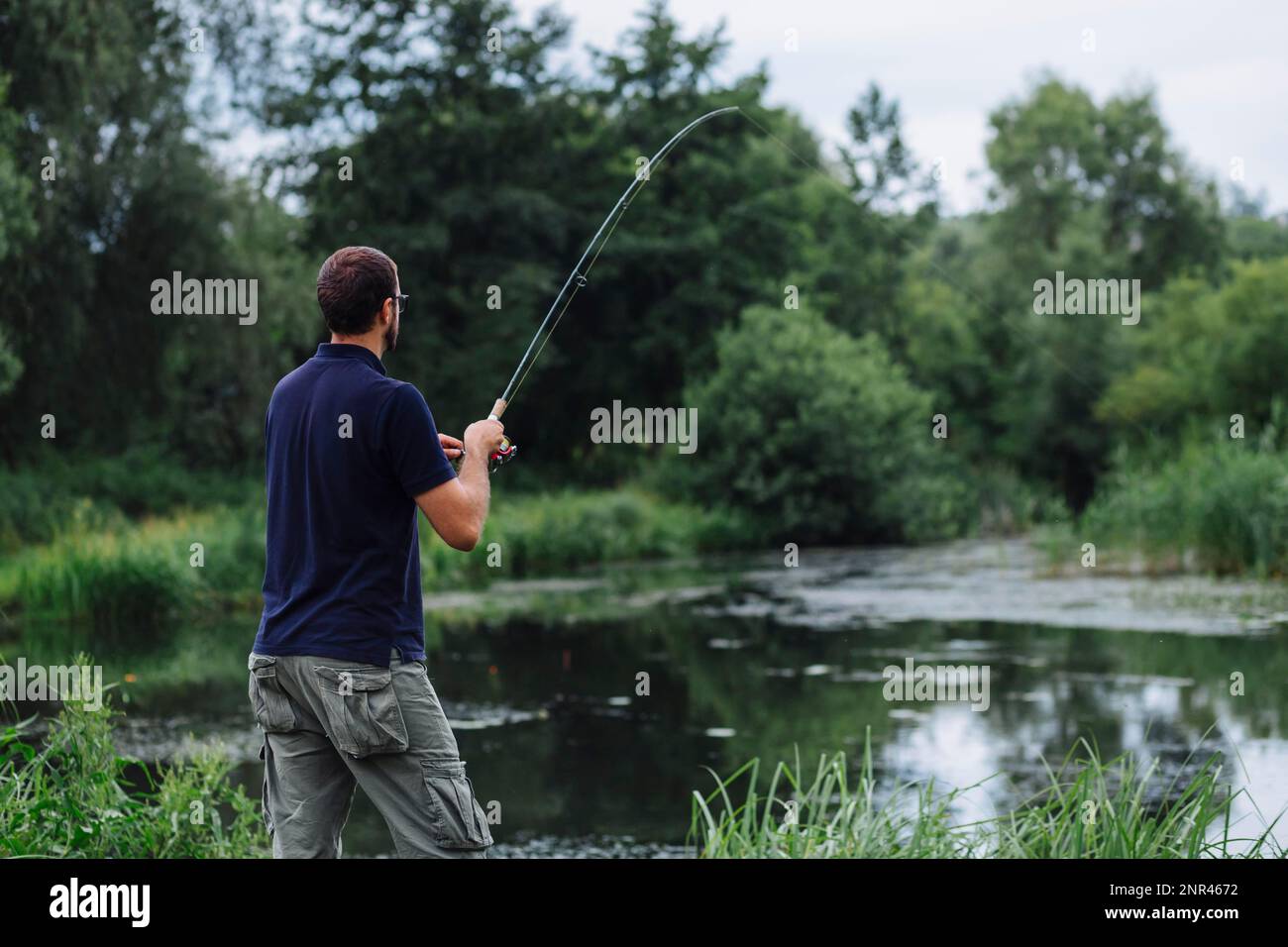 man fishing lake. High resolution photo Stock Photo - Alamy