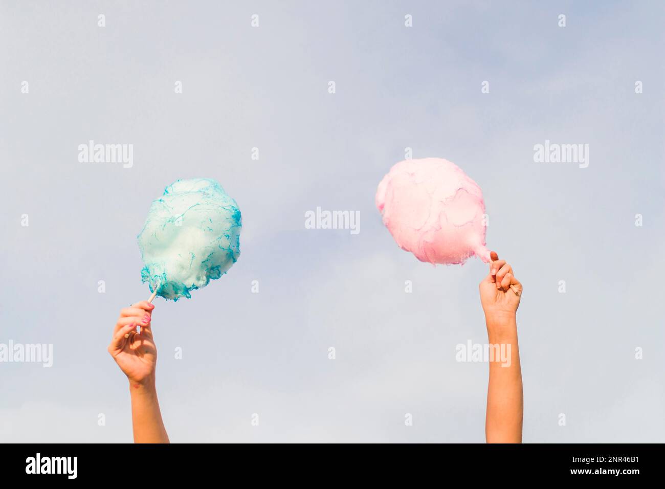 hands holding cotton candy. High resolution photo Stock Photo - Alamy