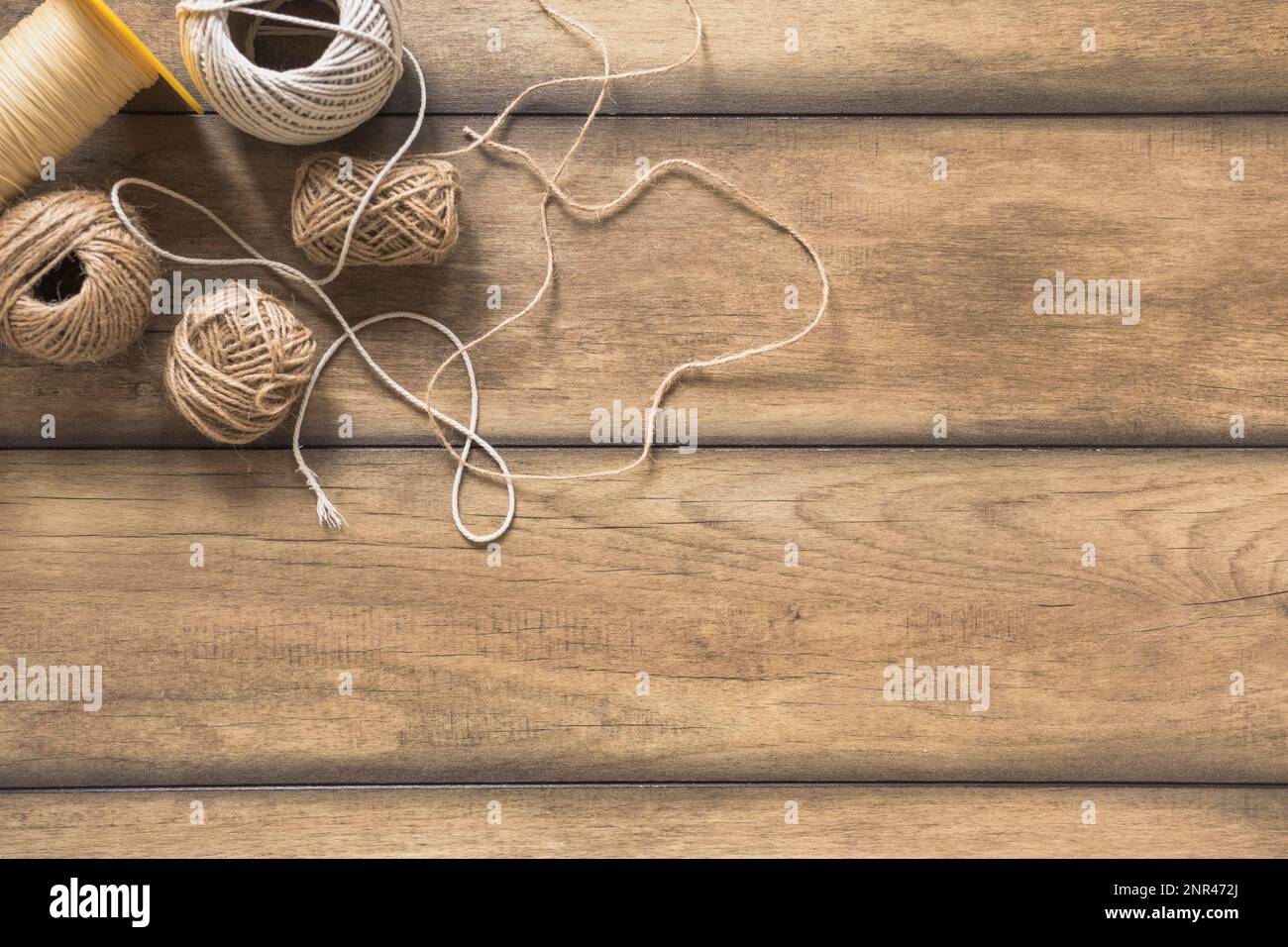 variety string spool wooden table. High resolution photo Stock Photo ...
