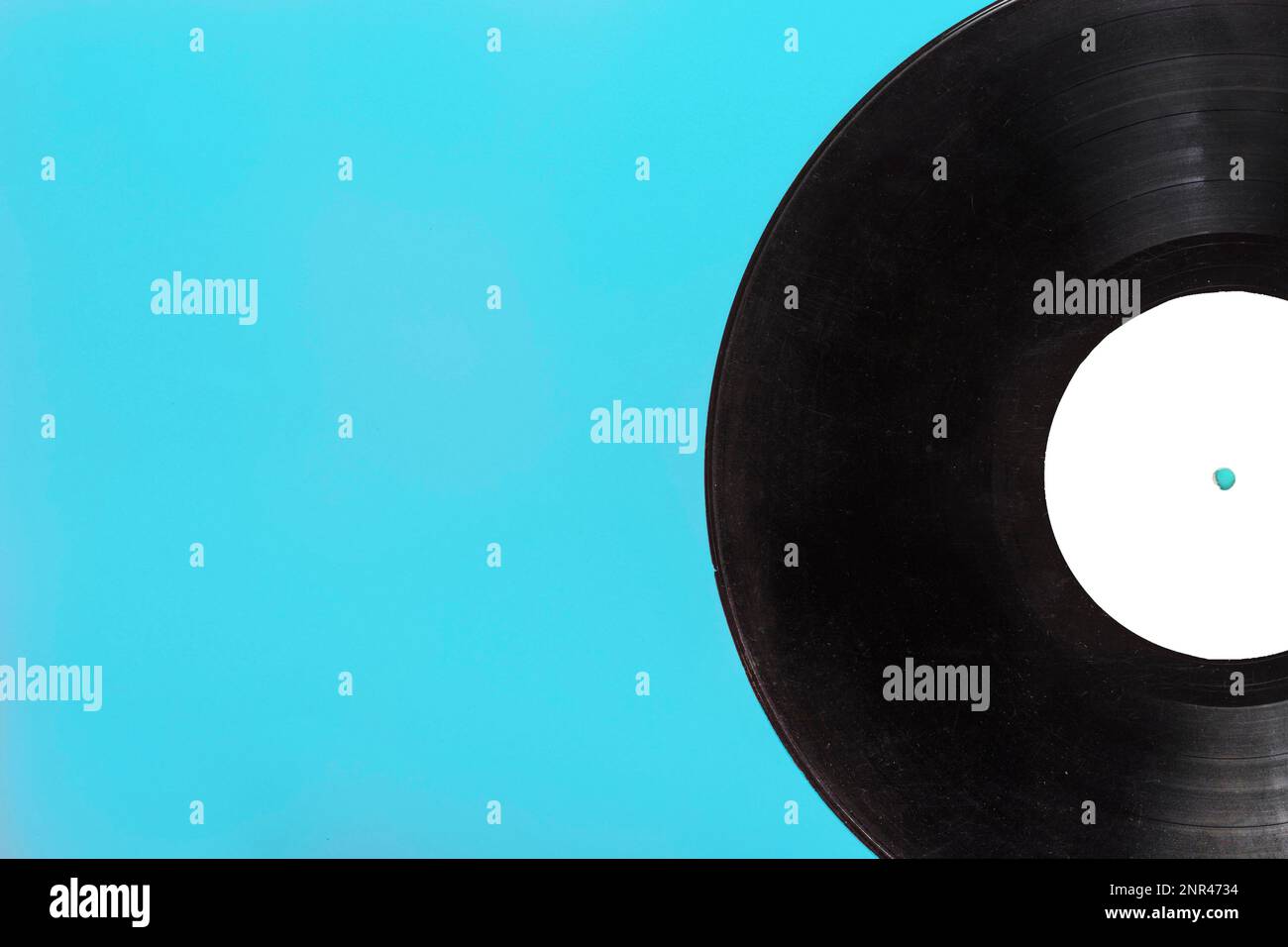single circular vinyl record blue background. High resolution photo ...
