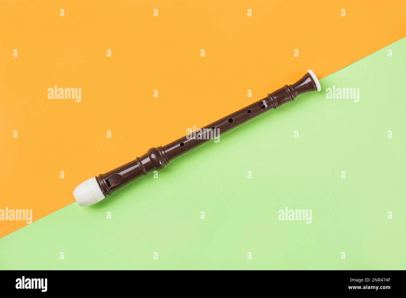 overhead view block flute dual orange green background. High resolution ...