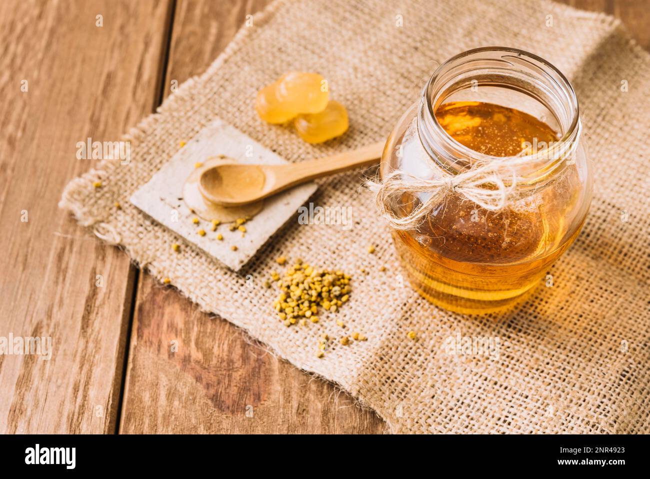 Sweet honey bee pollen seeds candies sack cloth Stock Photo - Alamy