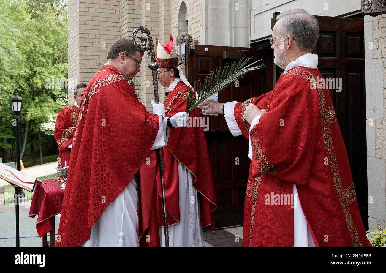 Father Christopher Roux, rector of the Cathedral of St. Patrick, passes ...