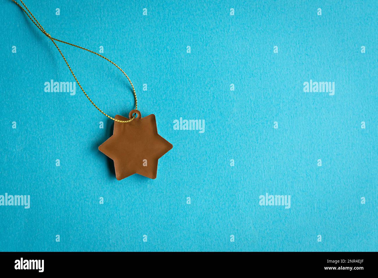 Star shape tag on blue background. Copy space. Template or mockup for ...