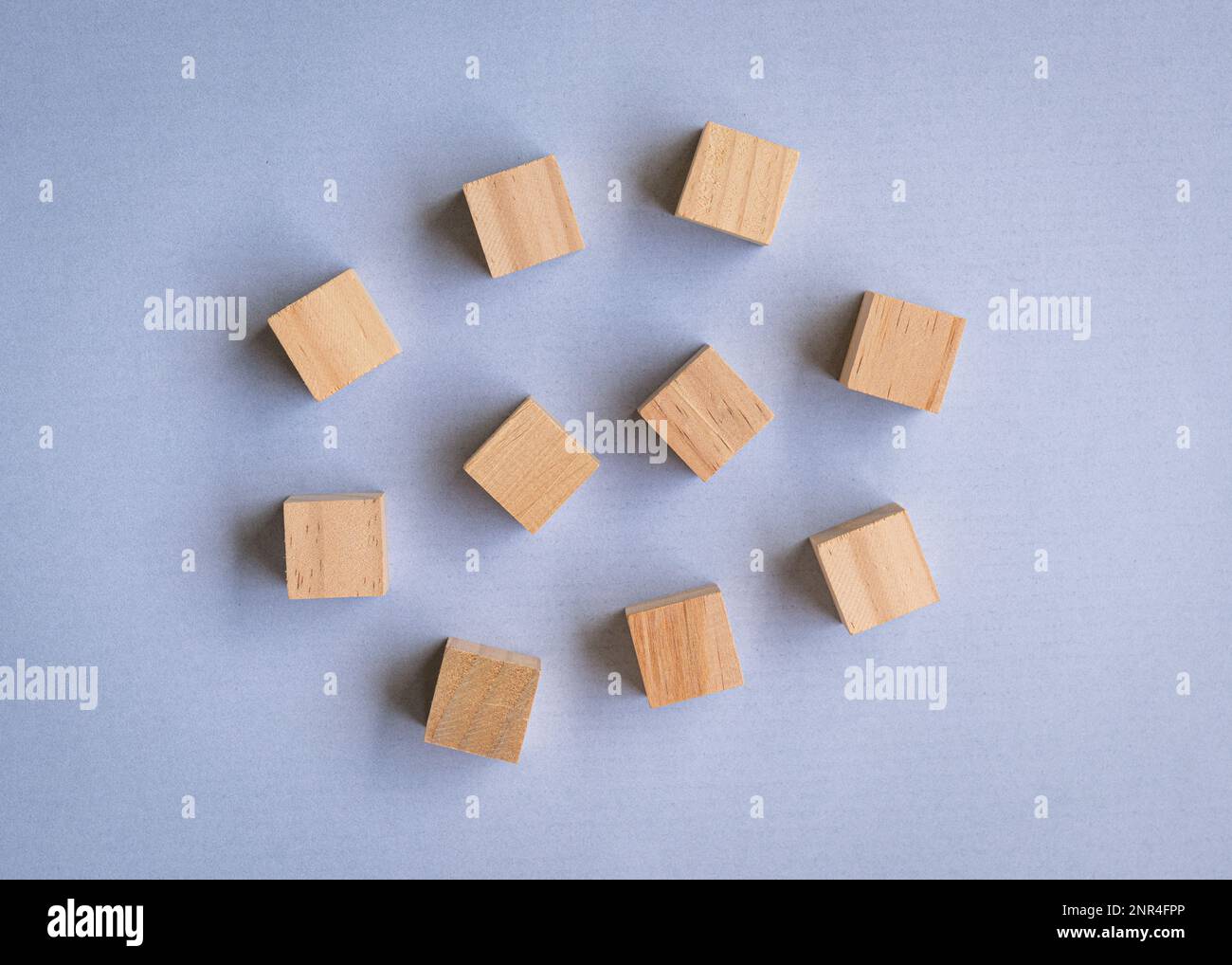 Ten blank wooden blocks on blue background. Top view Stock Photo - Alamy